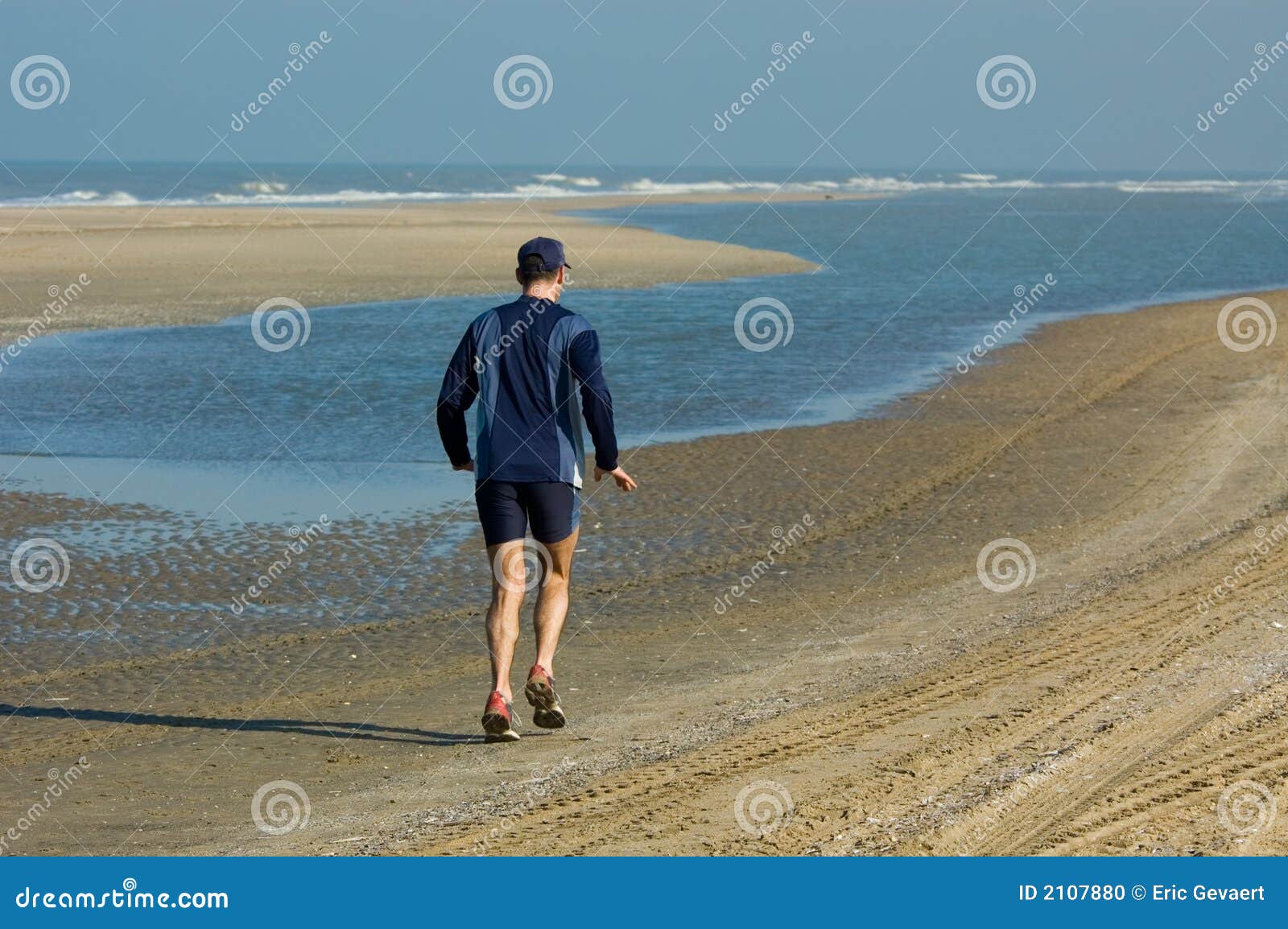 Running along the beach stock photo. Image of blue, leisure - 2107880