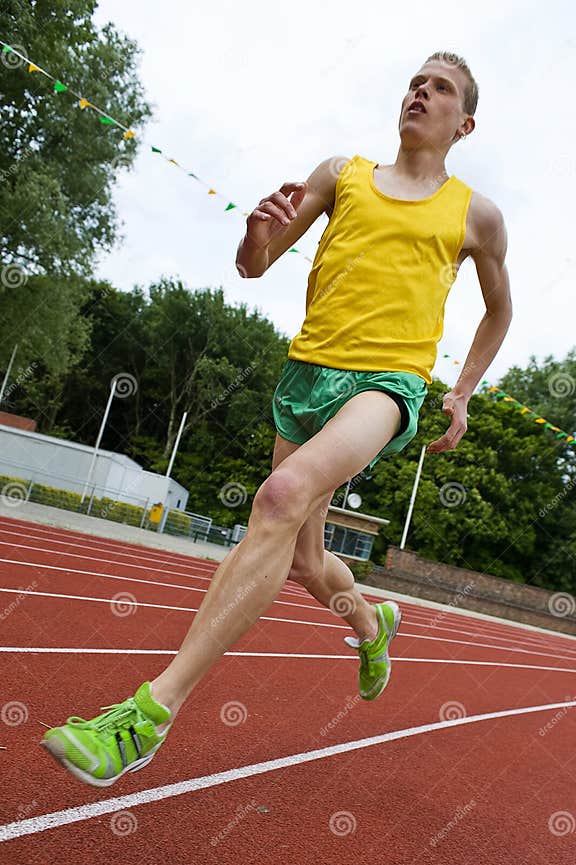 Running athlete in mid-air stock image. Image of athlete - 9693155