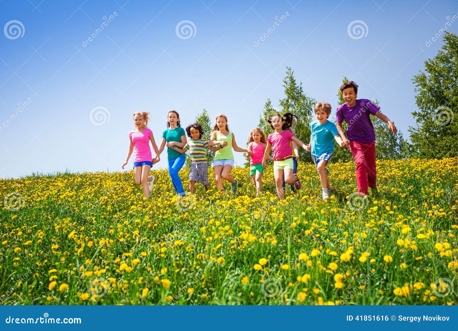 Running Children Holding Hands in Meadow Stock Photo - Image of child ...
