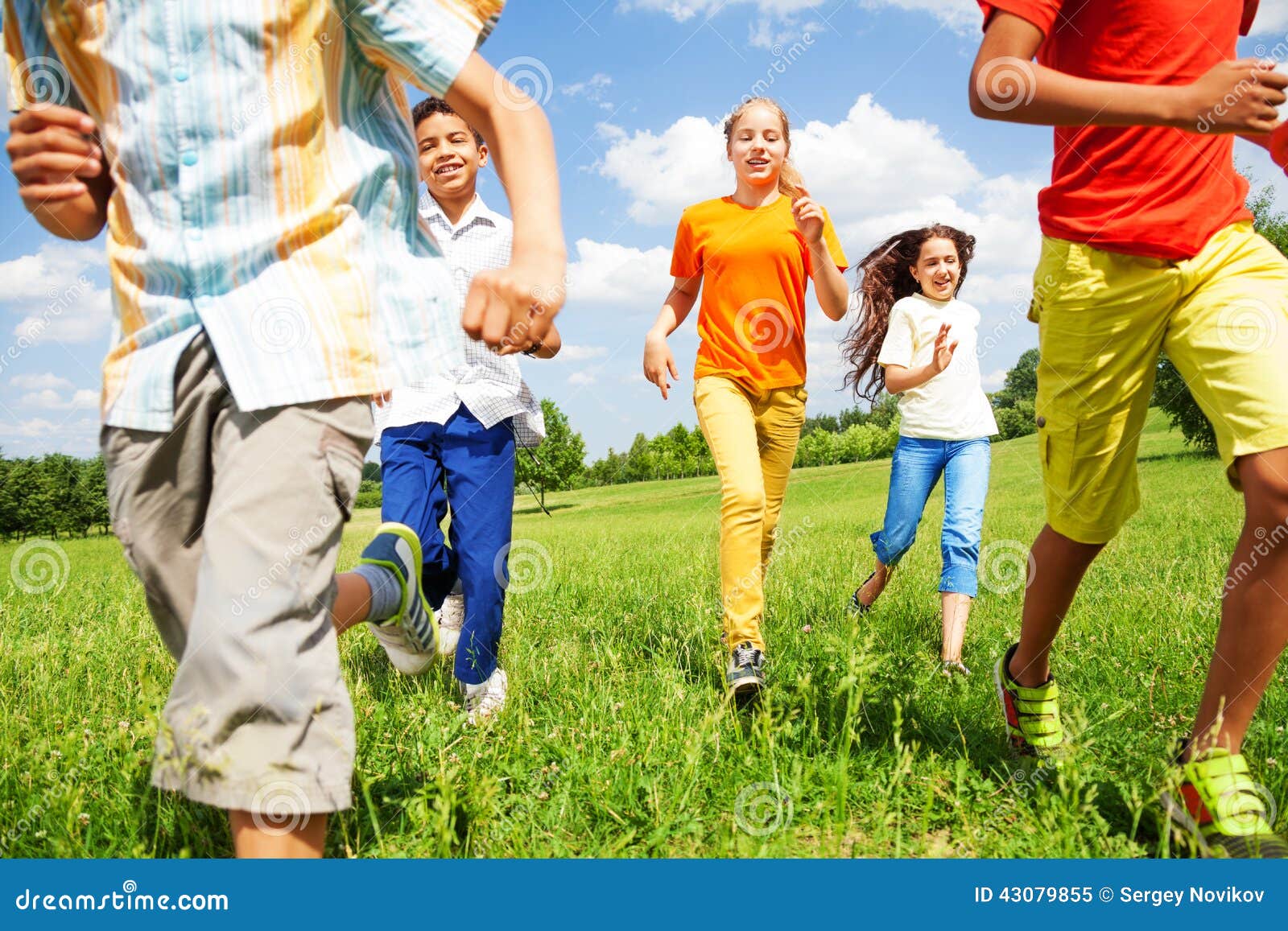 Running Children Together in Motion Outside Stock Image - Image of ...