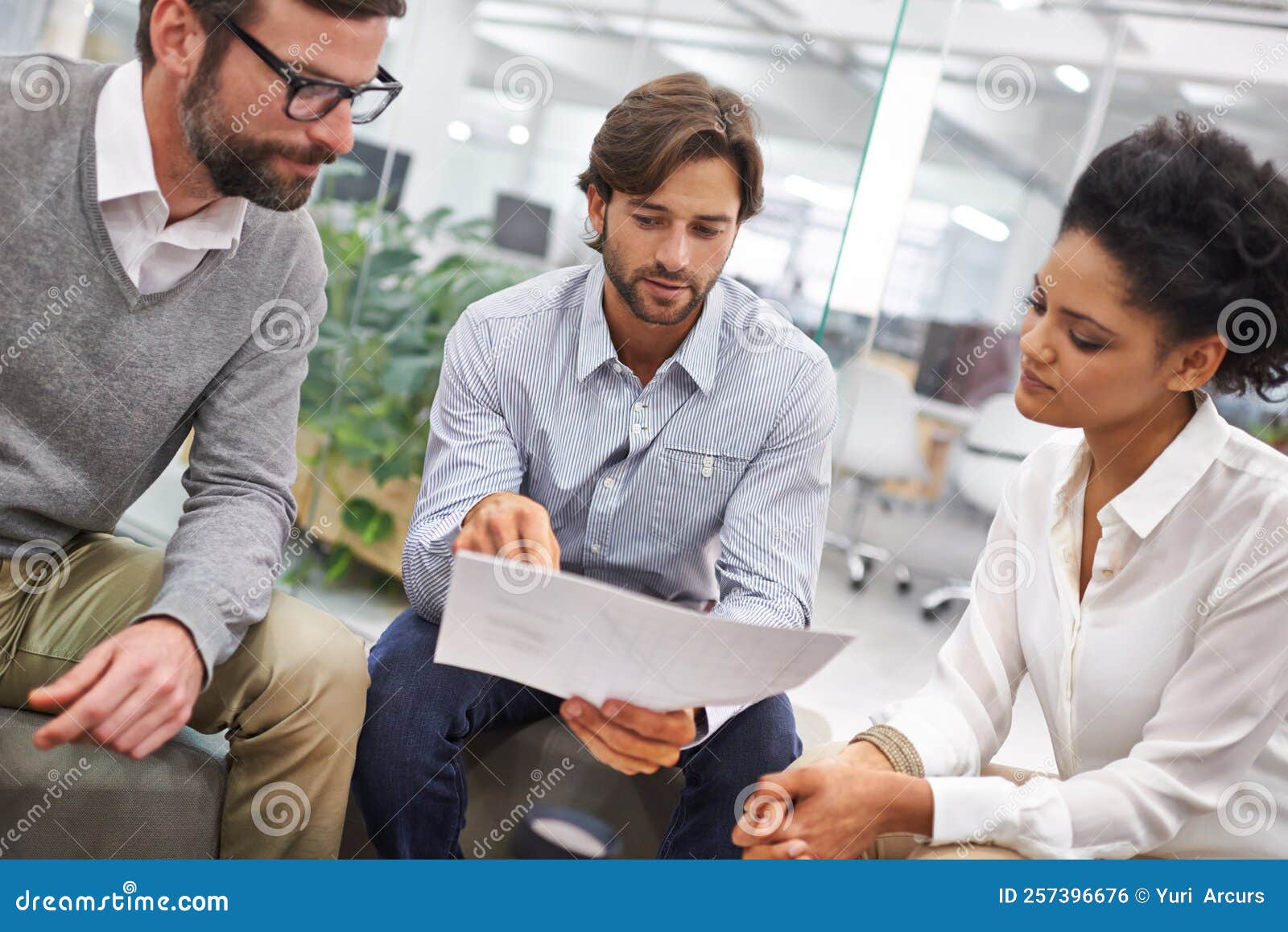 Running through the Contracts Details. a Group of Young Professionals ...