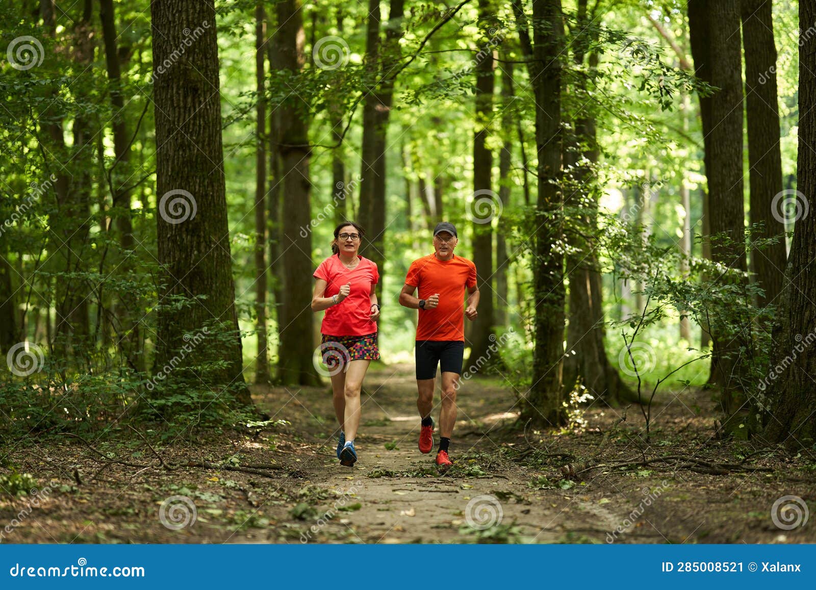 Running Couple in the Forest Stock Image - Image of runner, trail ...