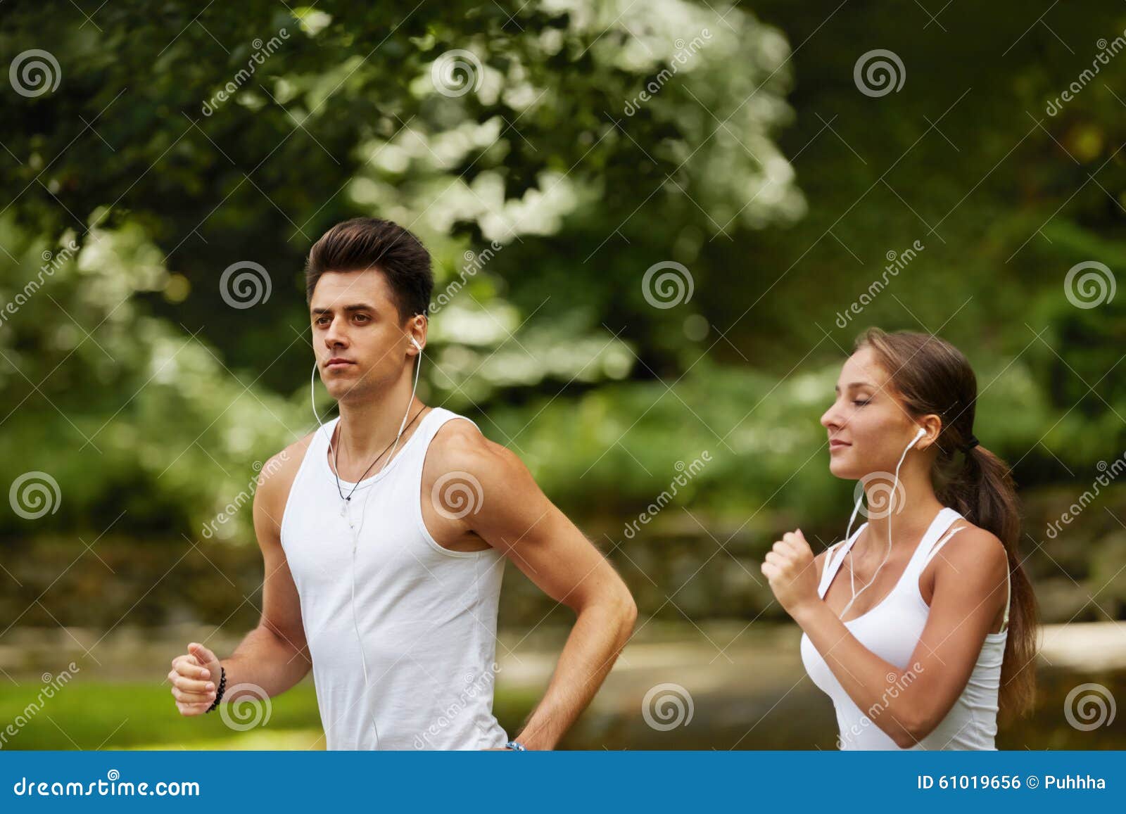 Running Couple. Young Couple Running in the Summer Park Stock Photo ...