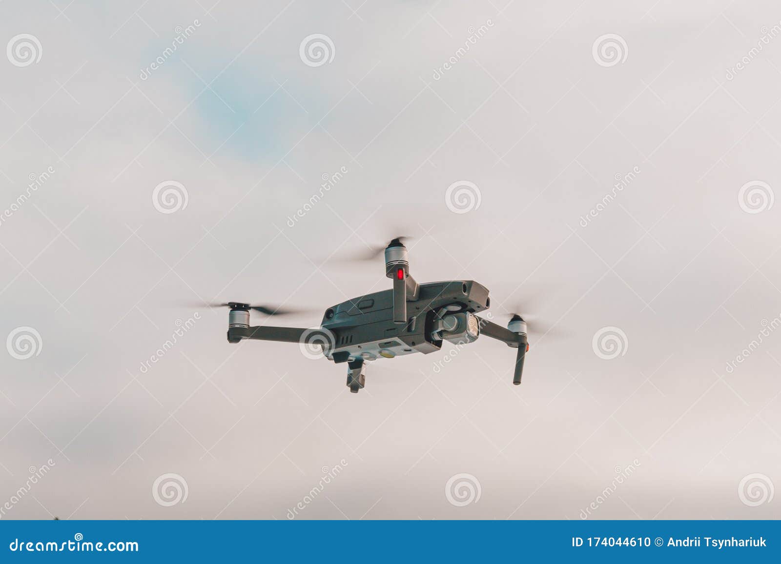 Running Drone into the Sky, Quadcopter on Blue Sky Background Stock ...