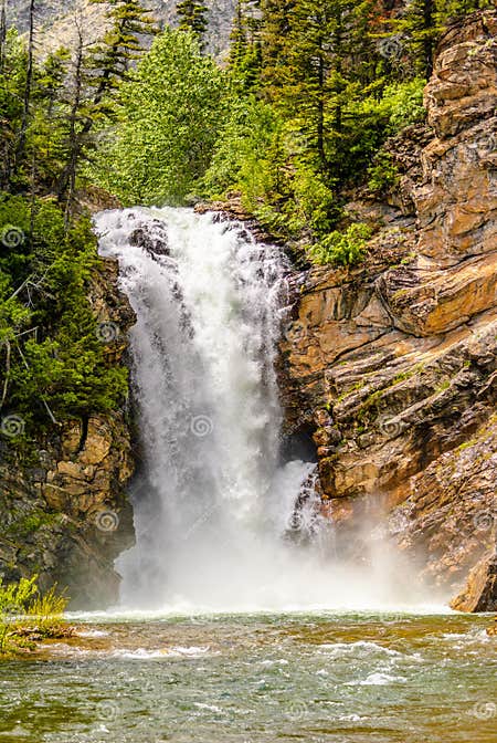 Portrait 0f Running Eagle Falls Raging with Snow Melt. Stock Image ...