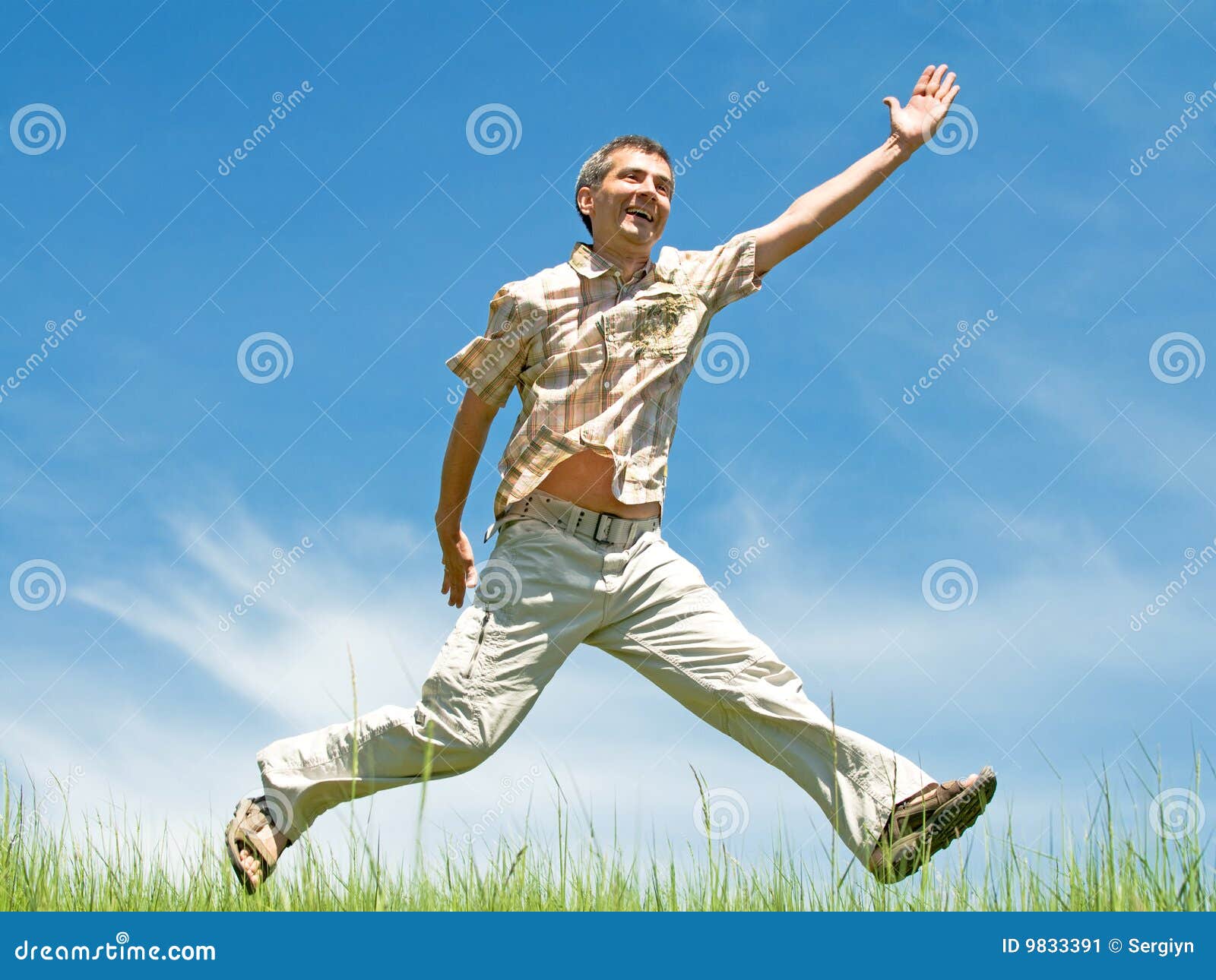 Running happy man stock image. Image of holiday, cloud - 9833391