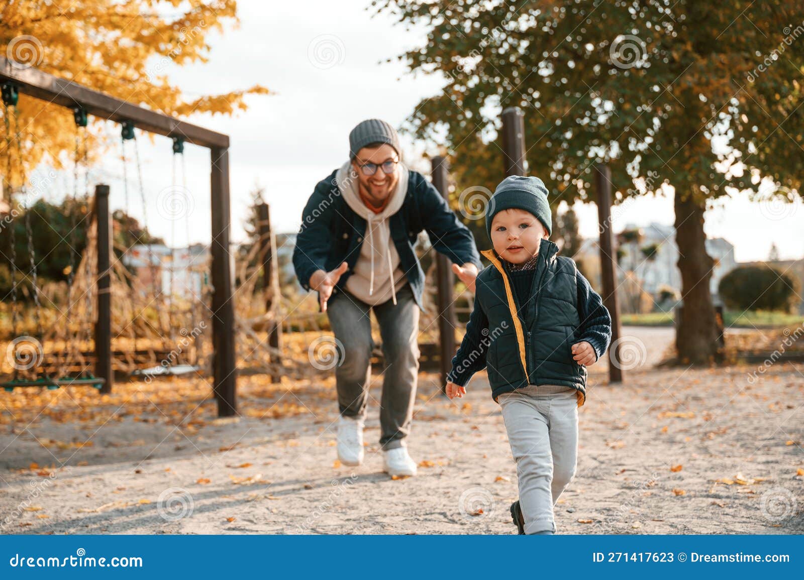 Running, Having Fun. Father and Young Son is Together Outdoors at ...