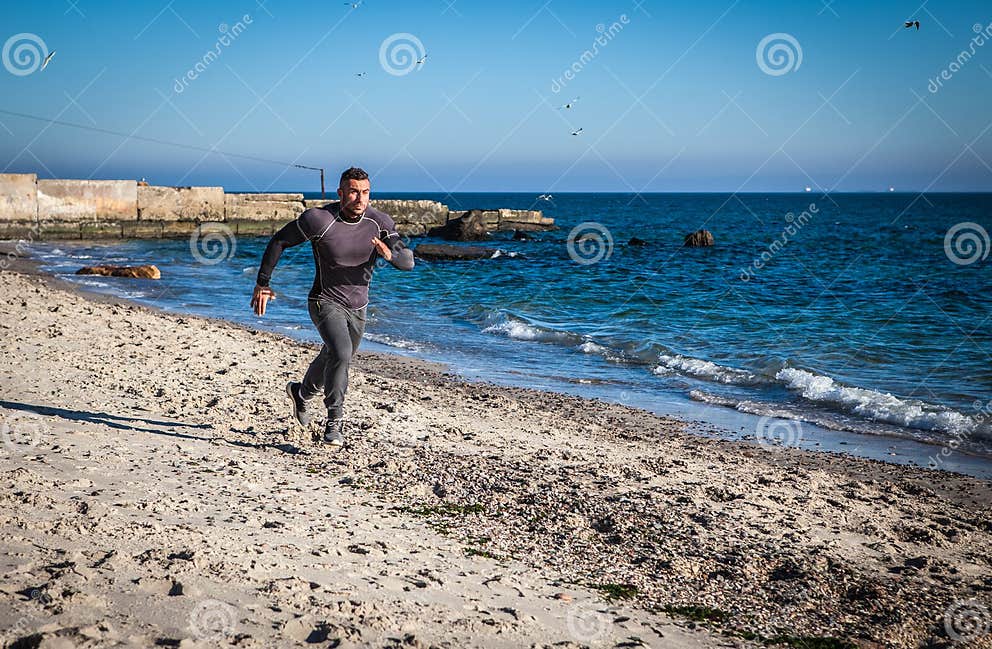 Running Man Jogging on Beach. Stock Image - Image of outdoors, muscular ...