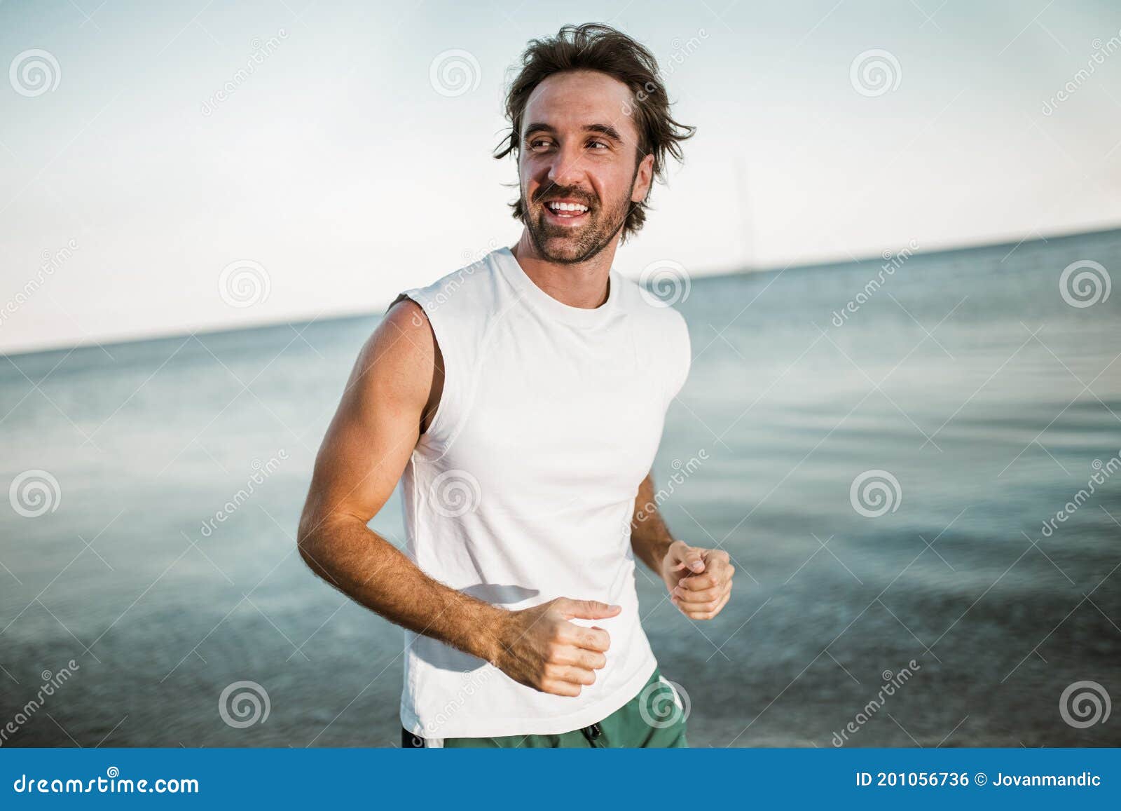 Man Jogging on Beach. Male Runner Training Outside Working Out Stock ...