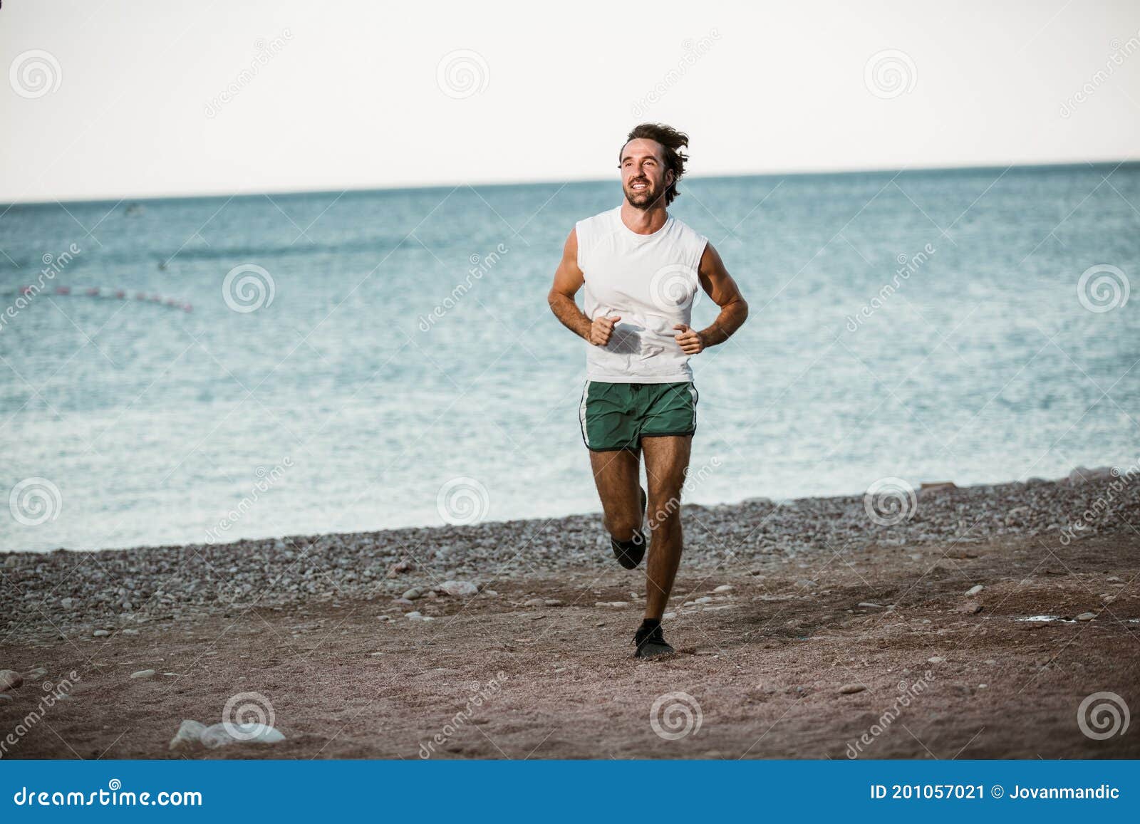 Man Jogging on Beach. Male Runner Training Outside Working Out Stock ...