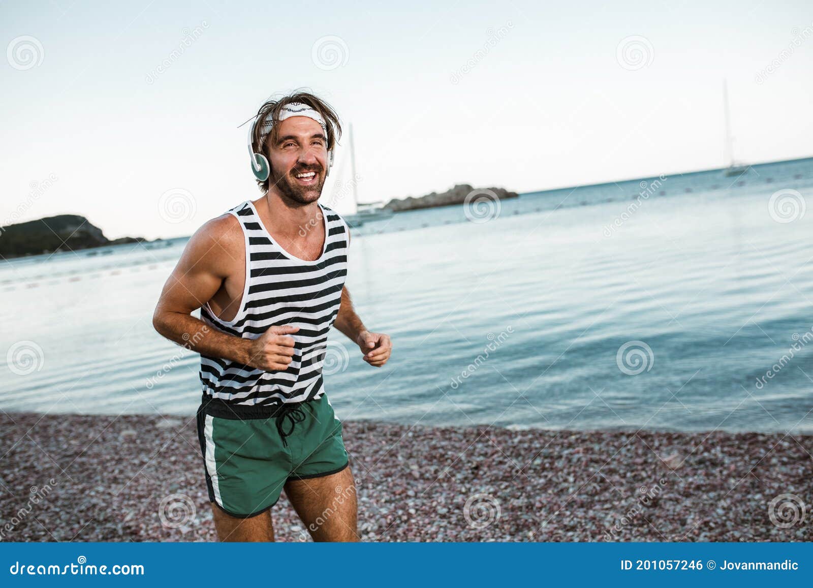 Man Jogging on Beach. Male Runner Training Outside Working Out Stock ...