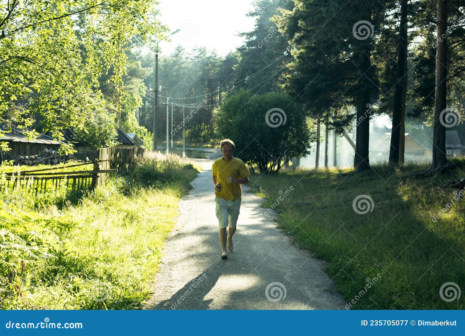 A Running Man Jogging in the Countryside in the Summer. Stock Image ...