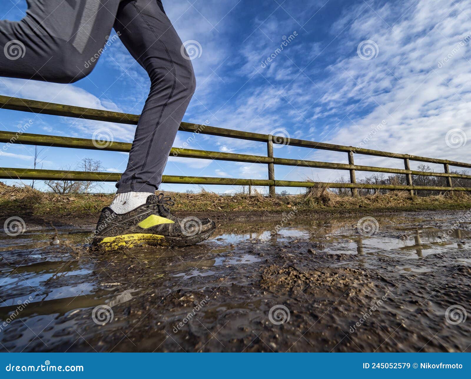 Running on a muddy trail stock image. Image of hiking - 245052579