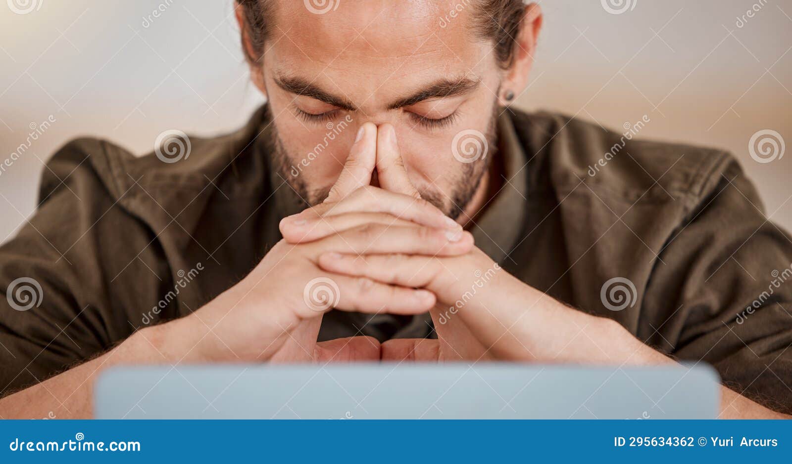 Running Out of Ideas. a Young Businessman Suffering from a Headache at ...