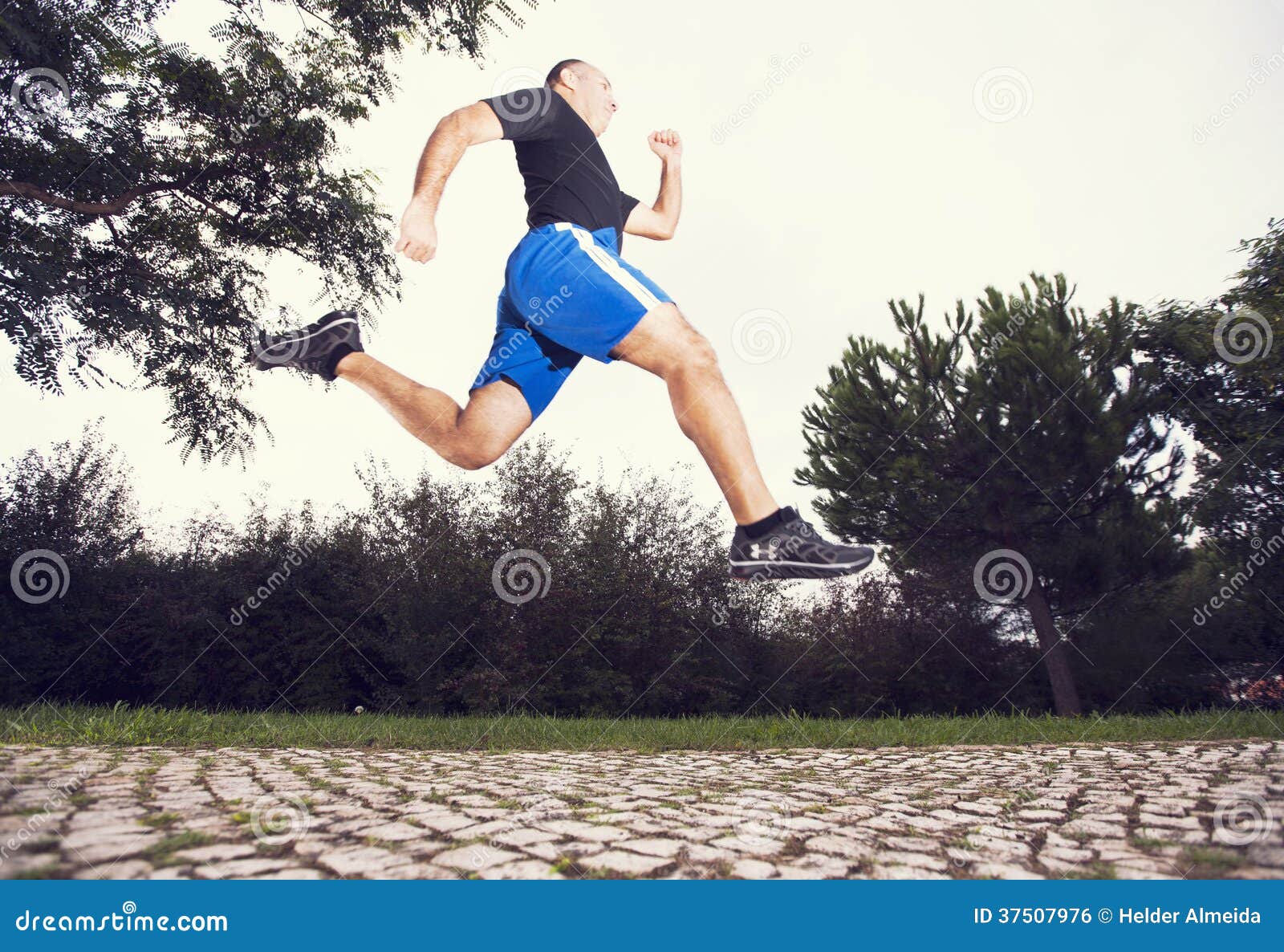 Running at the park stock photo. Image of clothing, motion - 37507976