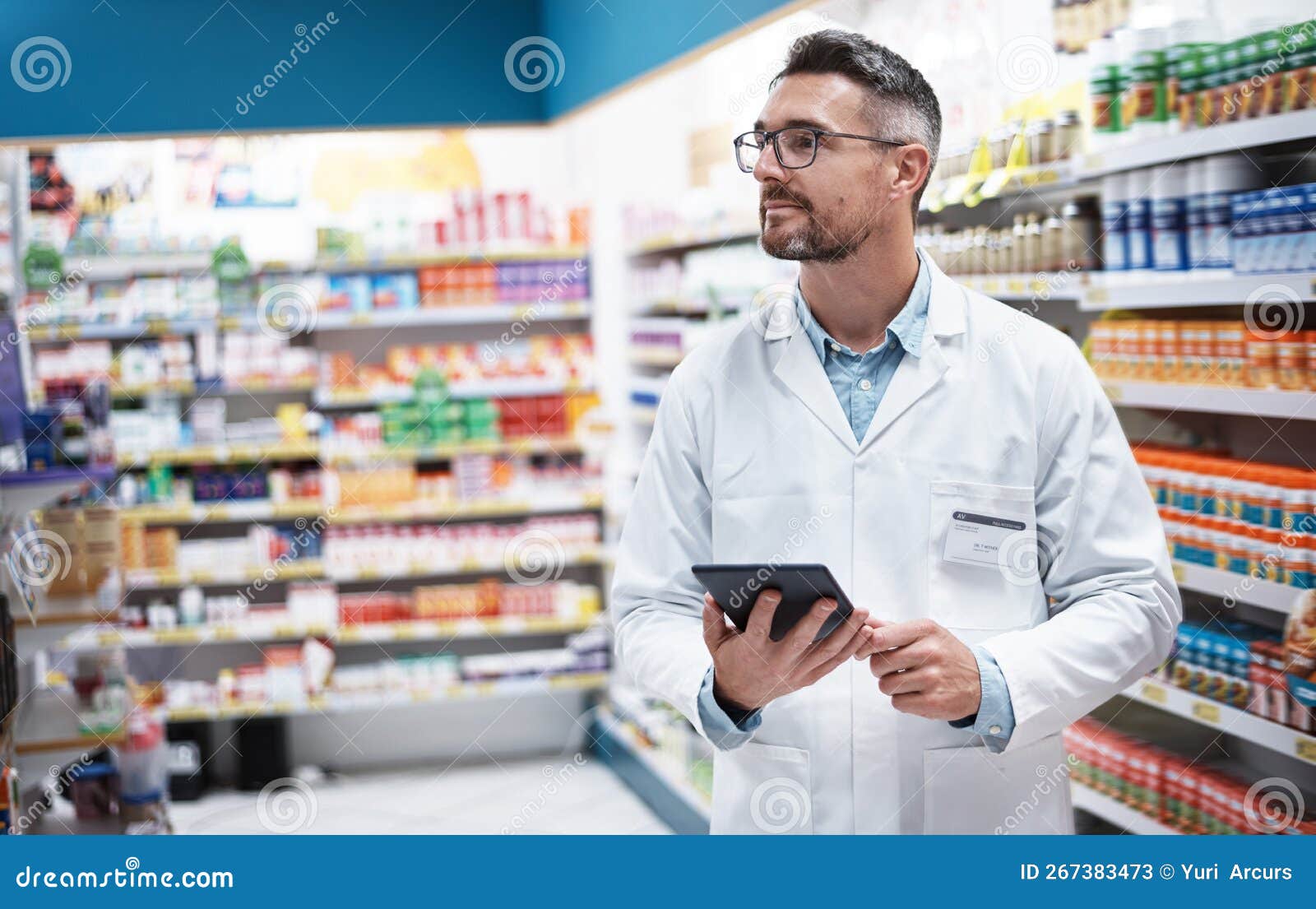 Running a Pharmacy in the Age of the App. a Handsome Mature Pharmacist ...
