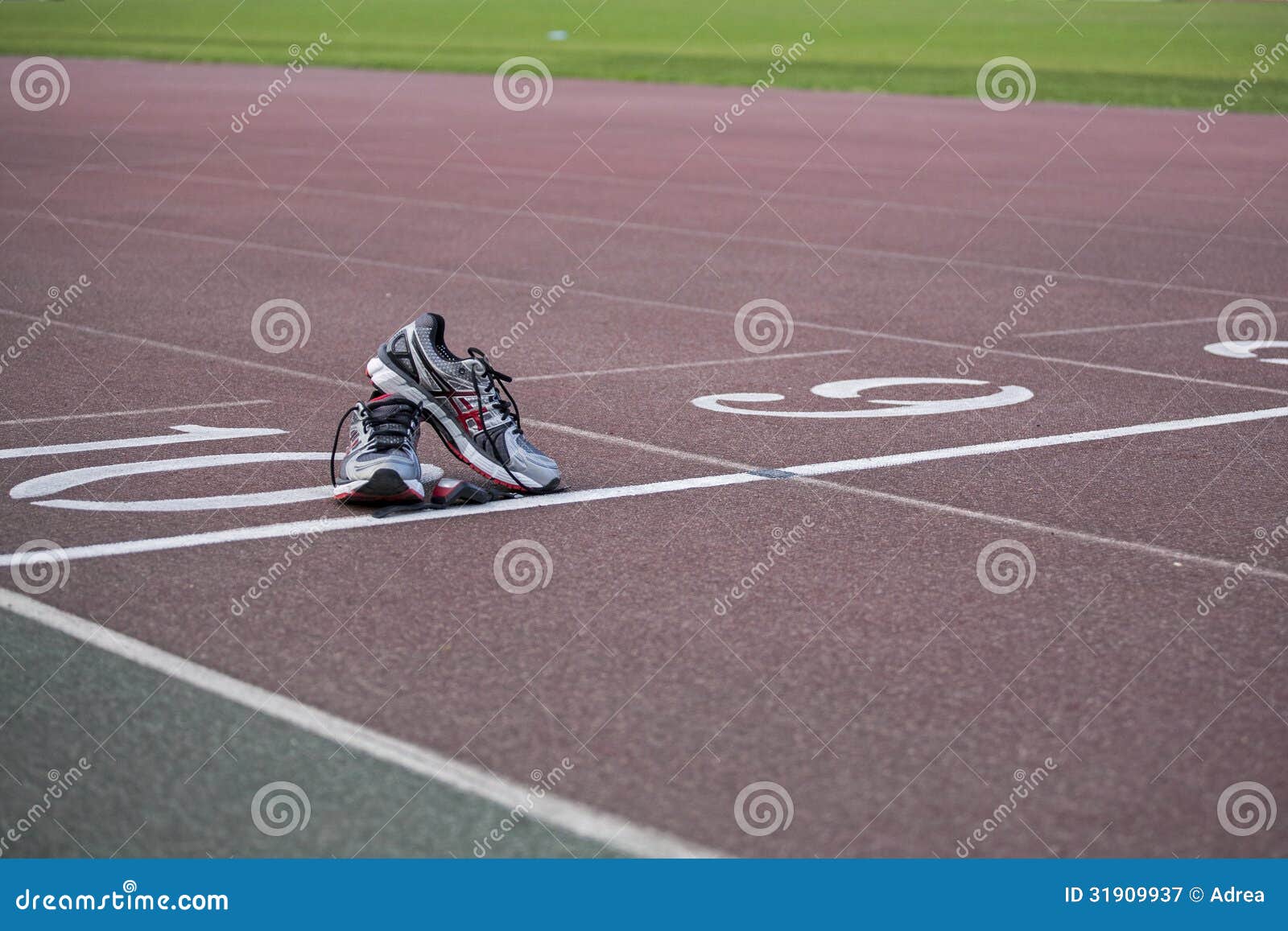 Running Shoes and a Watch on a Athletics Track Editorial Photography ...
