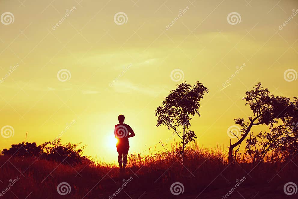 Running at the sunset stock photo. Image of crosscountry - 32405272