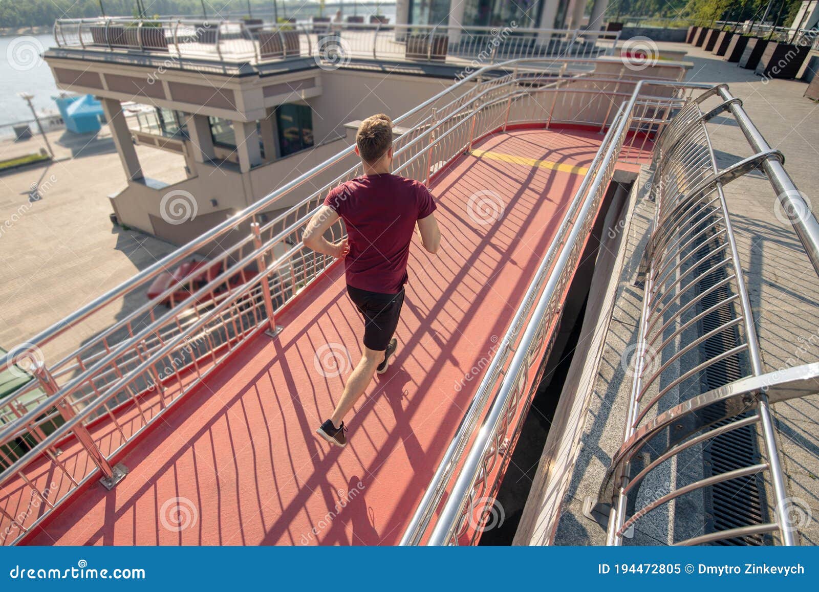 Young Brown-haired Male Running Across the Bridge Stock Image - Image ...