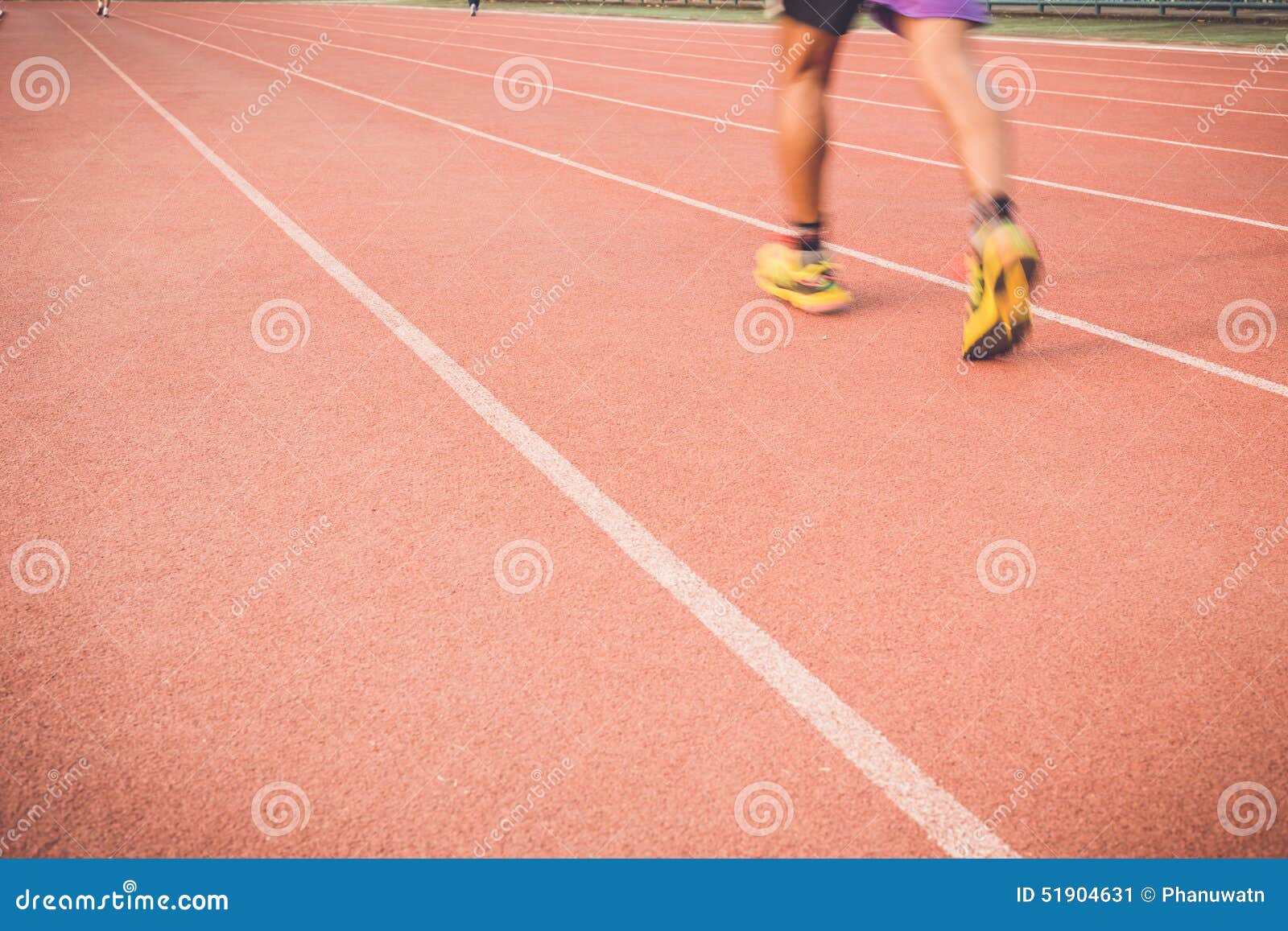 Running Track with Blur of Runner Feet in Stadium Stock Image - Image ...