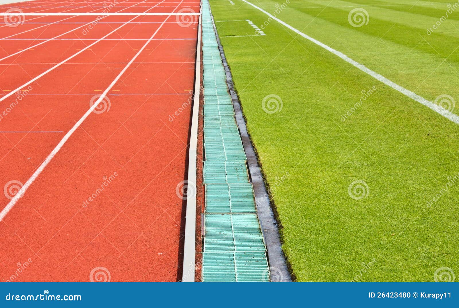 A running track and grass. stock photo. Image of numbers - 26423480
