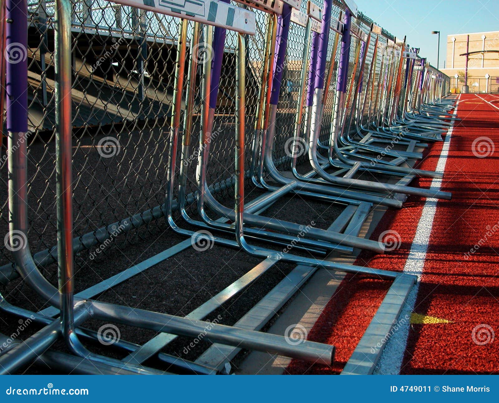 Running Track-Hurdles Along Fence Stock Image - Image of lanes, meet ...