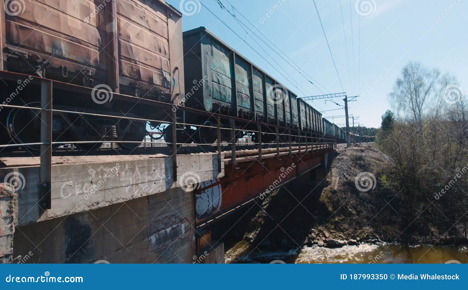 Running Train on Old Bridge Over River. Clip. Freight Train Passing ...