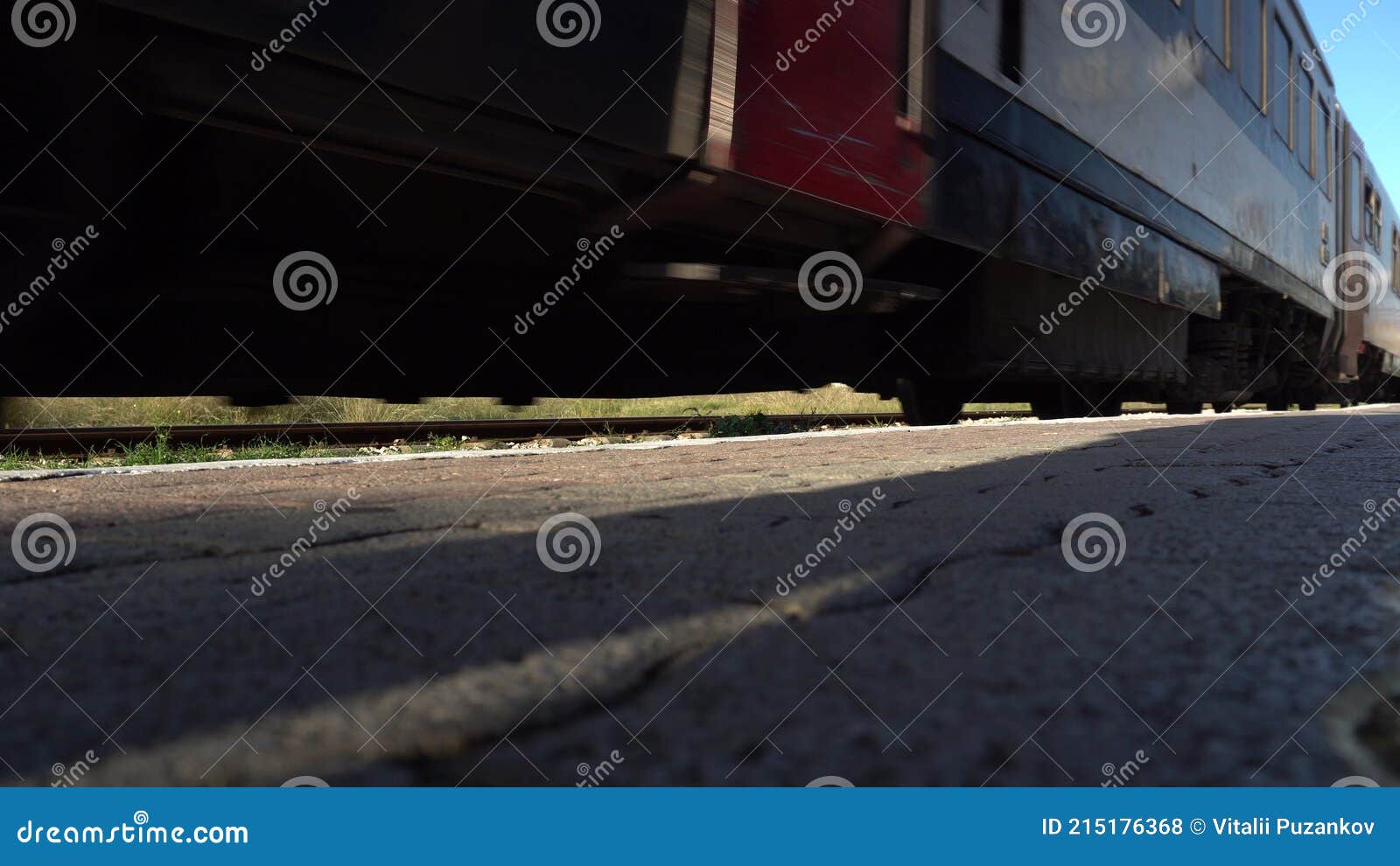 Running Train View from Below. a Train Pulls Up To a Platform Slowing ...