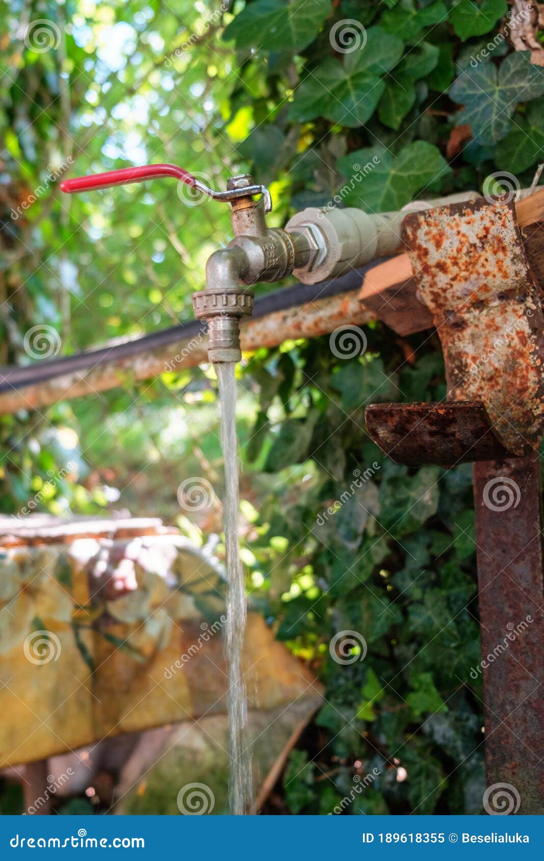 Running Water from the Rusty Water Tap in the Garden Stock Image ...