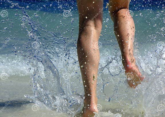 Running through waves stock photo. Image of sport, color - 592174