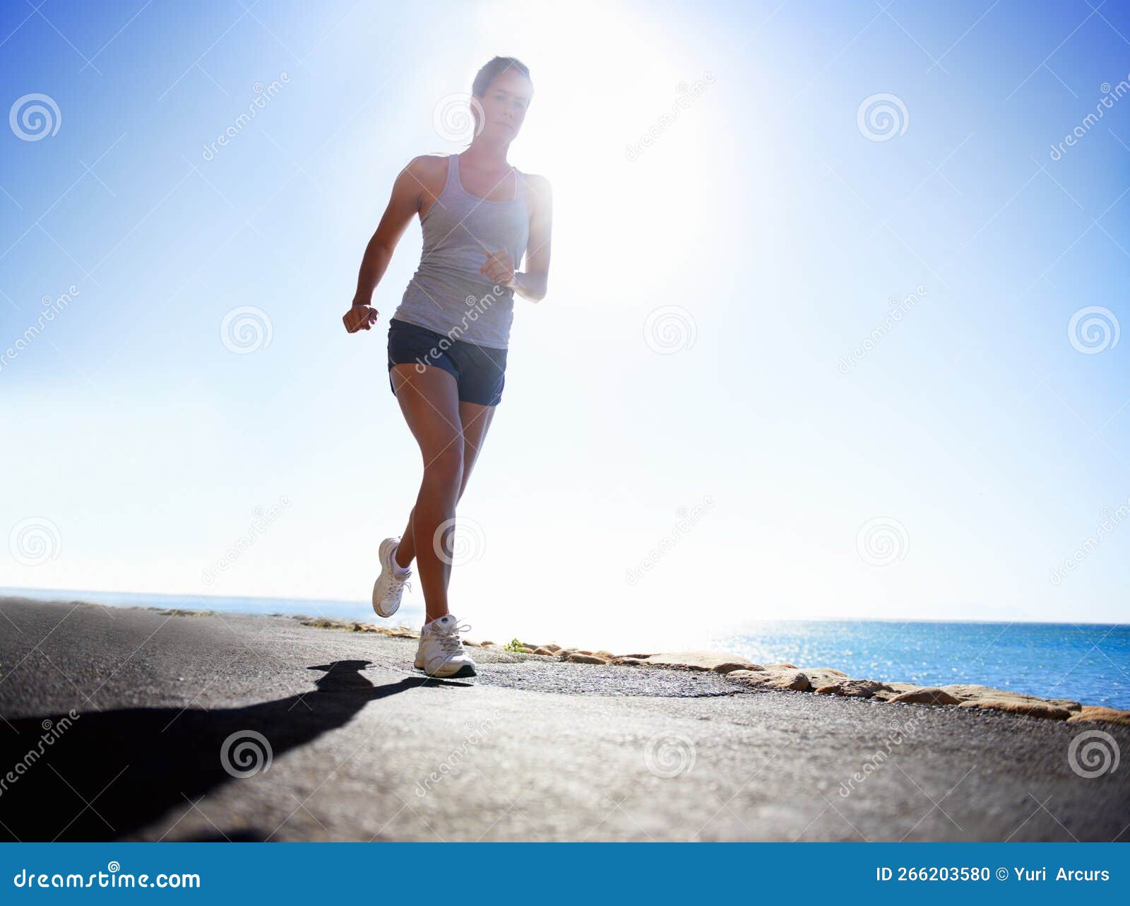 Running is a Way of Life. Low Angle View of a Runner Next To the Ocean ...