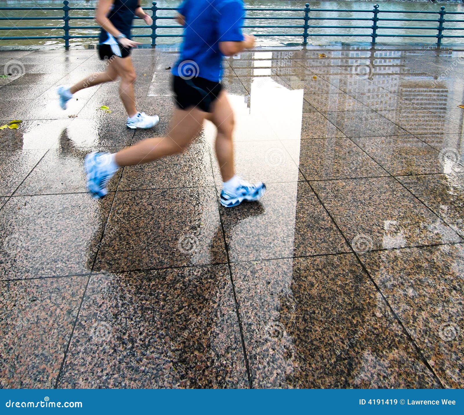 Running on a Wet Evening stock image. Image of reflections - 4191419