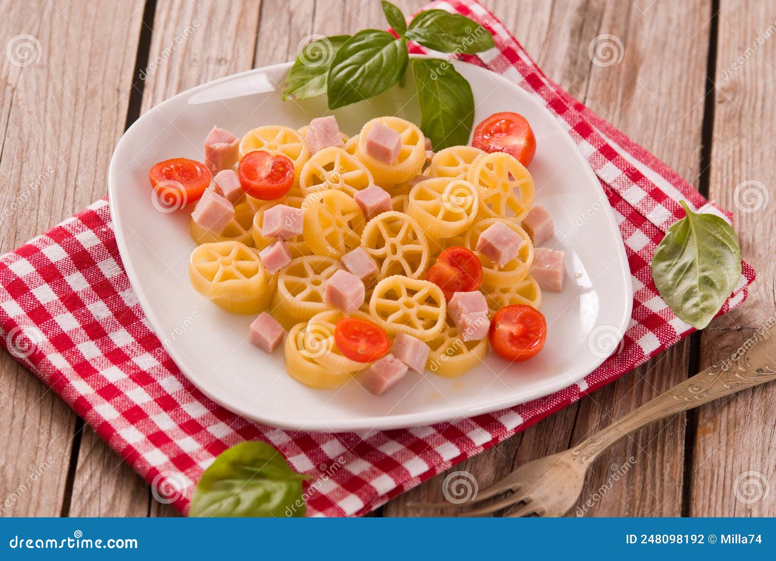 Ruote Pasta with Tomato and Ham. Stock Photo - Image of herb, gourmet ...