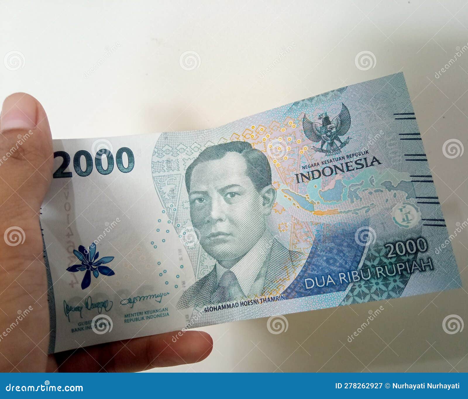 2000 Rupiah Bill Money Holding Hands Isolate in White Stock Image ...