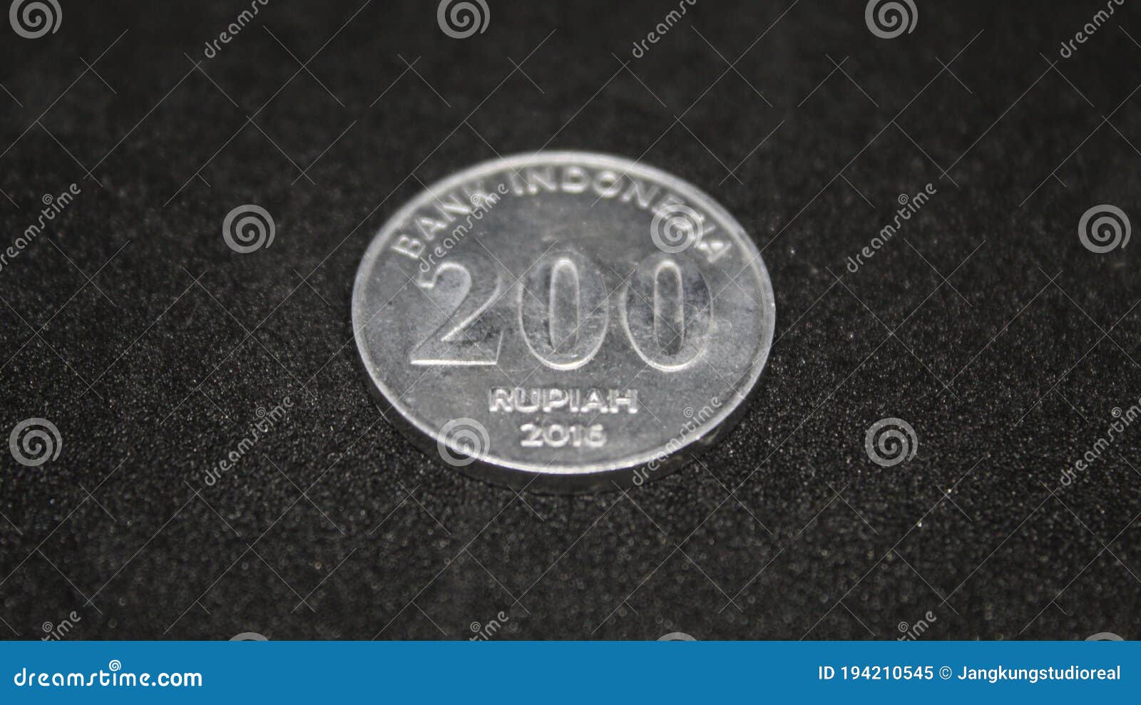 200 Rupiah of Indonesian Coins on a Black Background Stock Image ...