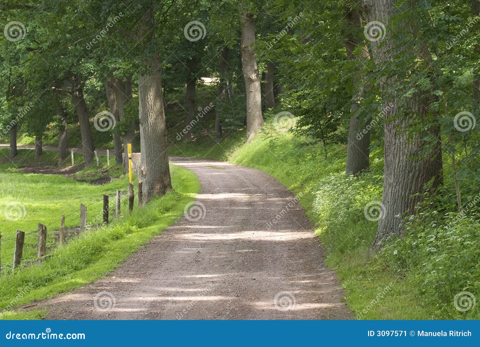 Rural Path Leading Past Two Circular Brick Towers Royalty-Free Stock ...