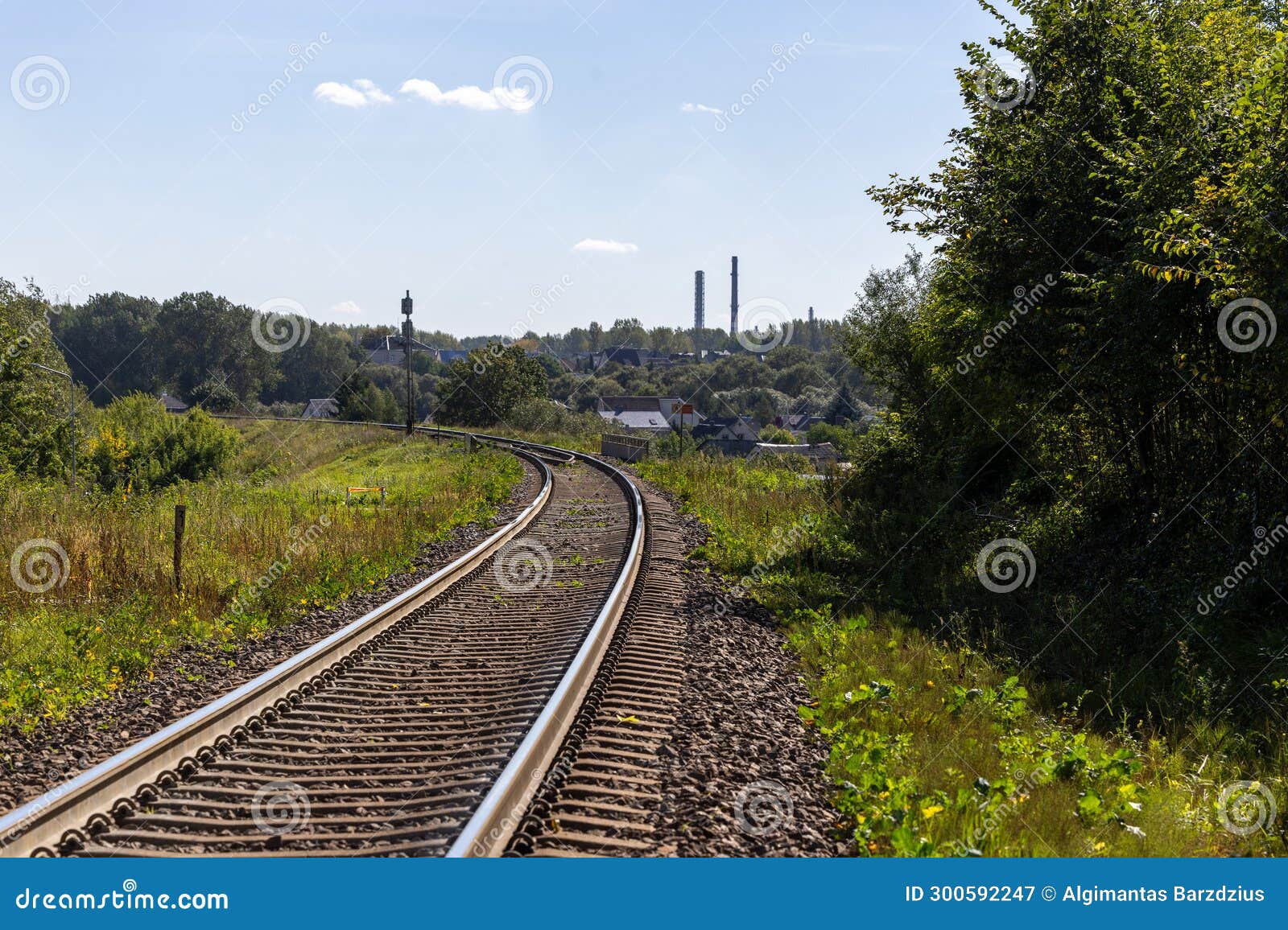 Rural Railway Scene with Industrial Backdrop Stock Image - Image of ...