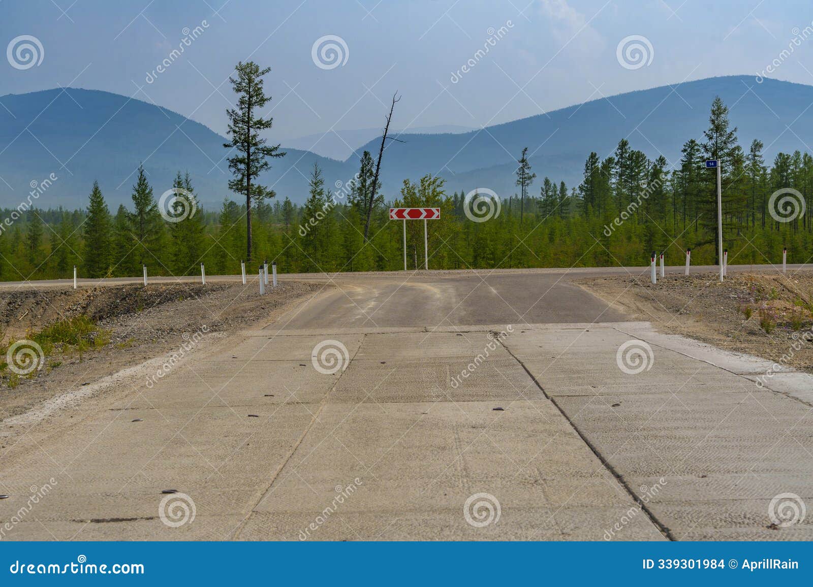 Rural Road Intersection with Forest and Mountains in the Background ...