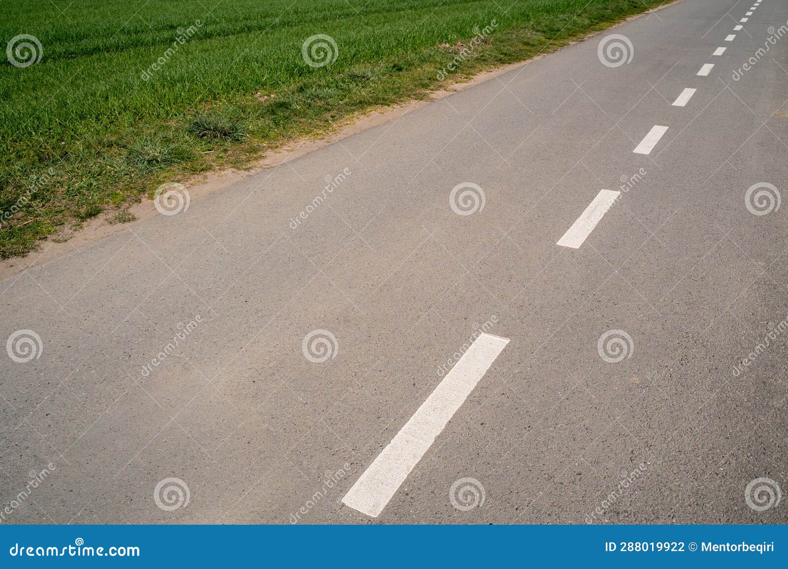 Rural Road in the Landscape with Grass on the Side Stock Photo - Image ...