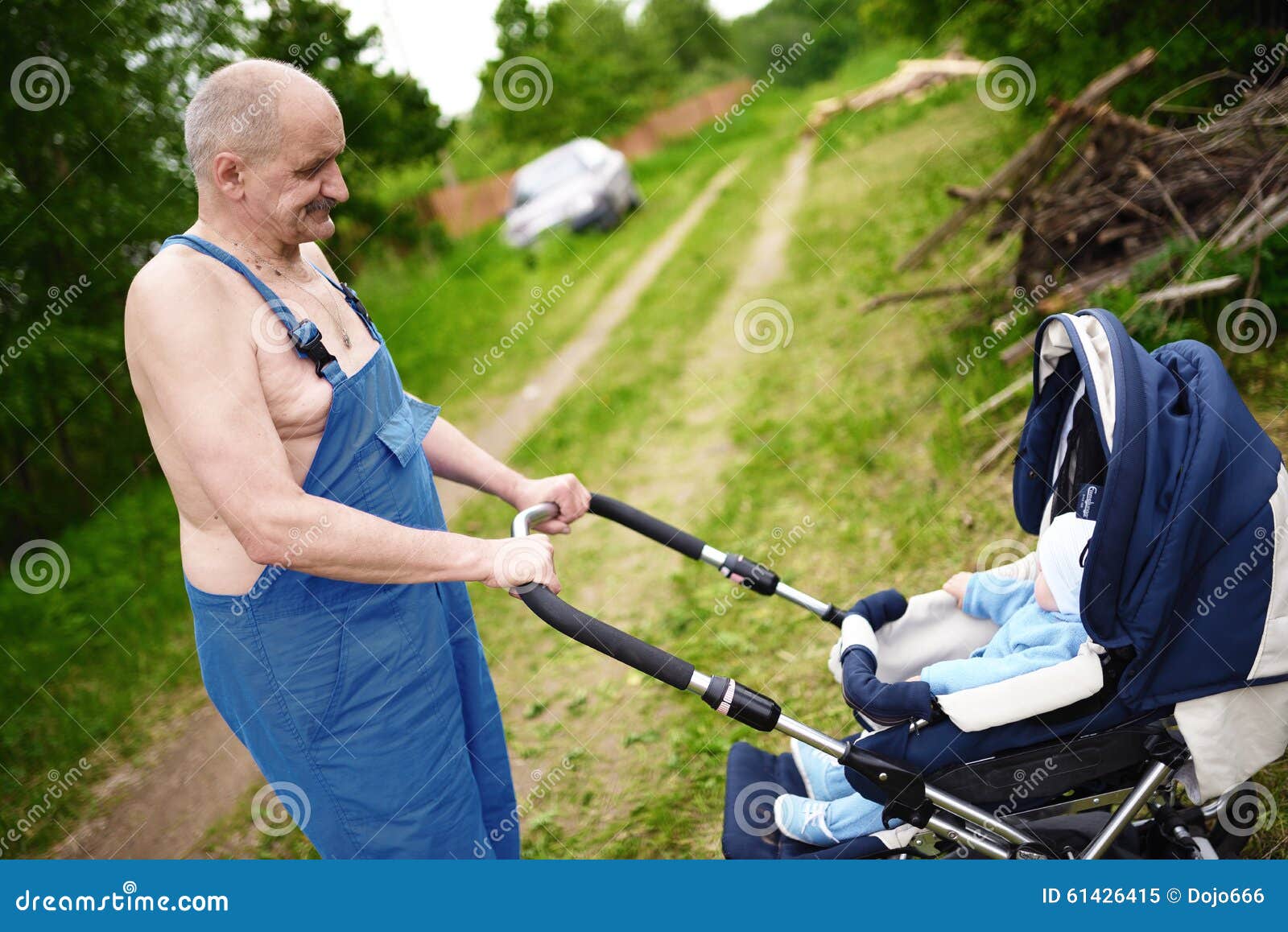 Rural Style Grandfather Pushing a Baby Stroller Stock Image - Image of ...