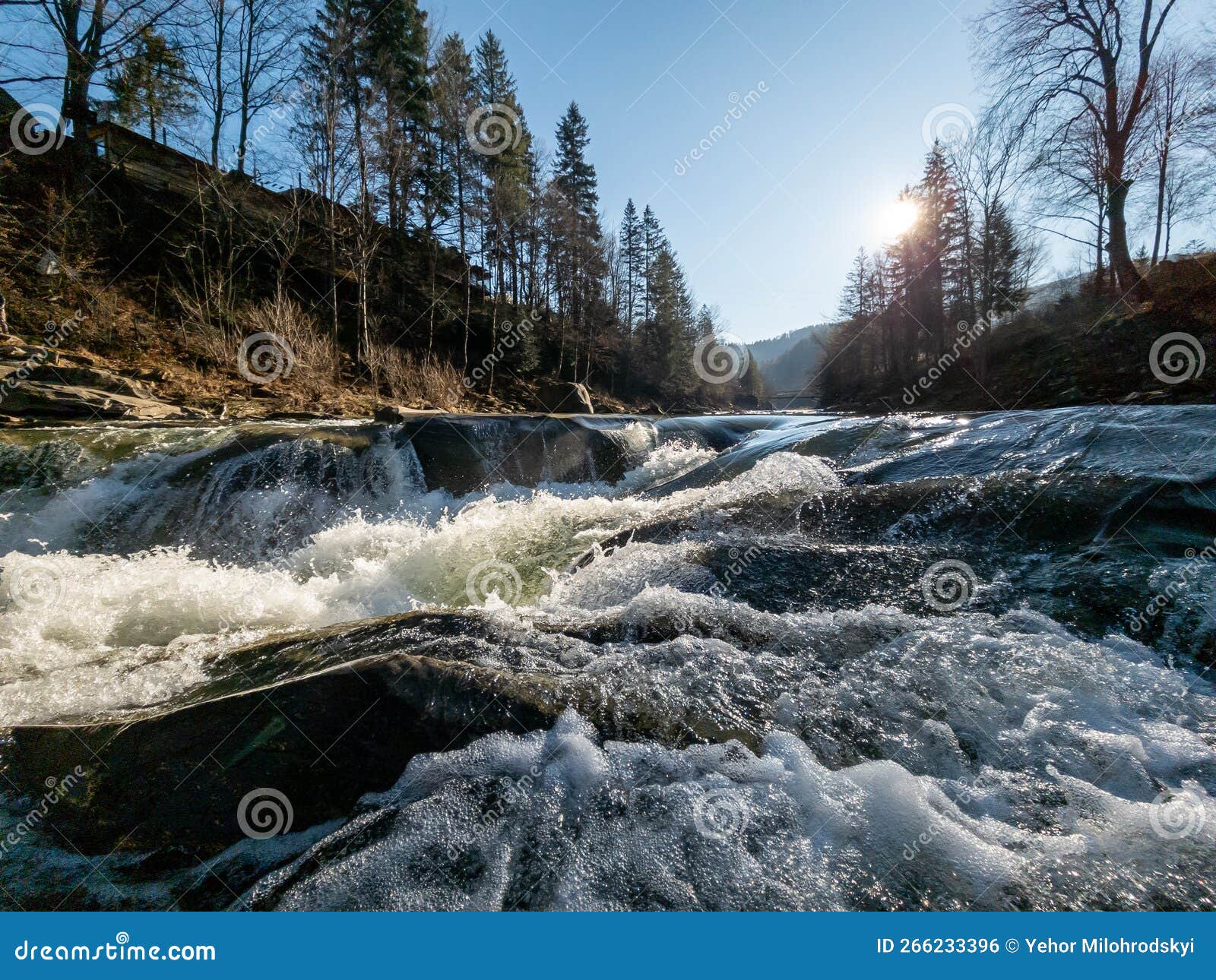 Rushing River Over Rocks in Forest with Mountains Stock Photo - Image ...