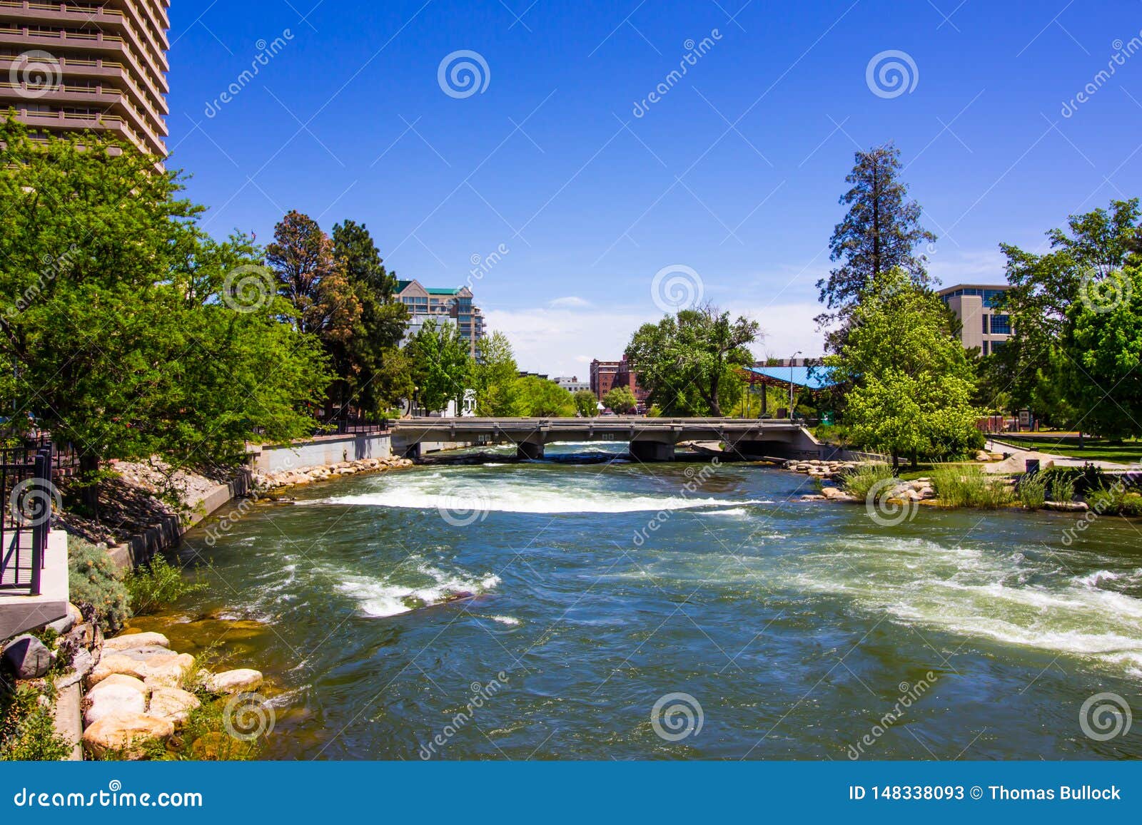 Rushing River Under Bridge in Downtown Area Stock Image - Image of span ...