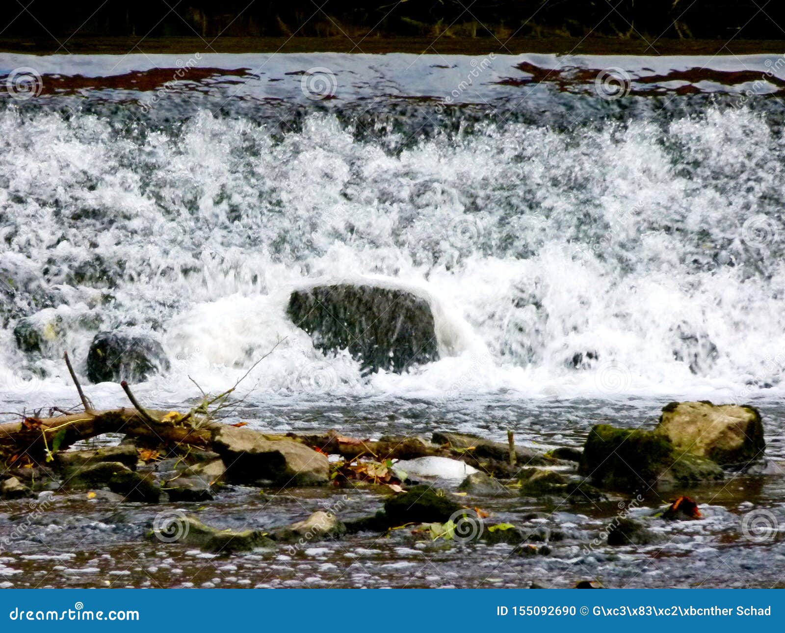 Rushing Waterfall with Rocks and Rocks in Front of it Stock Photo ...