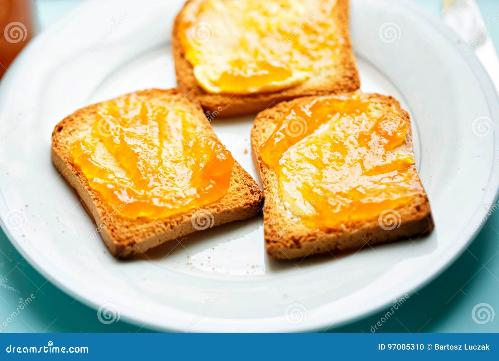 Rusk with Apricot Jam on Blue Surface Stock Photo - Image of butter ...