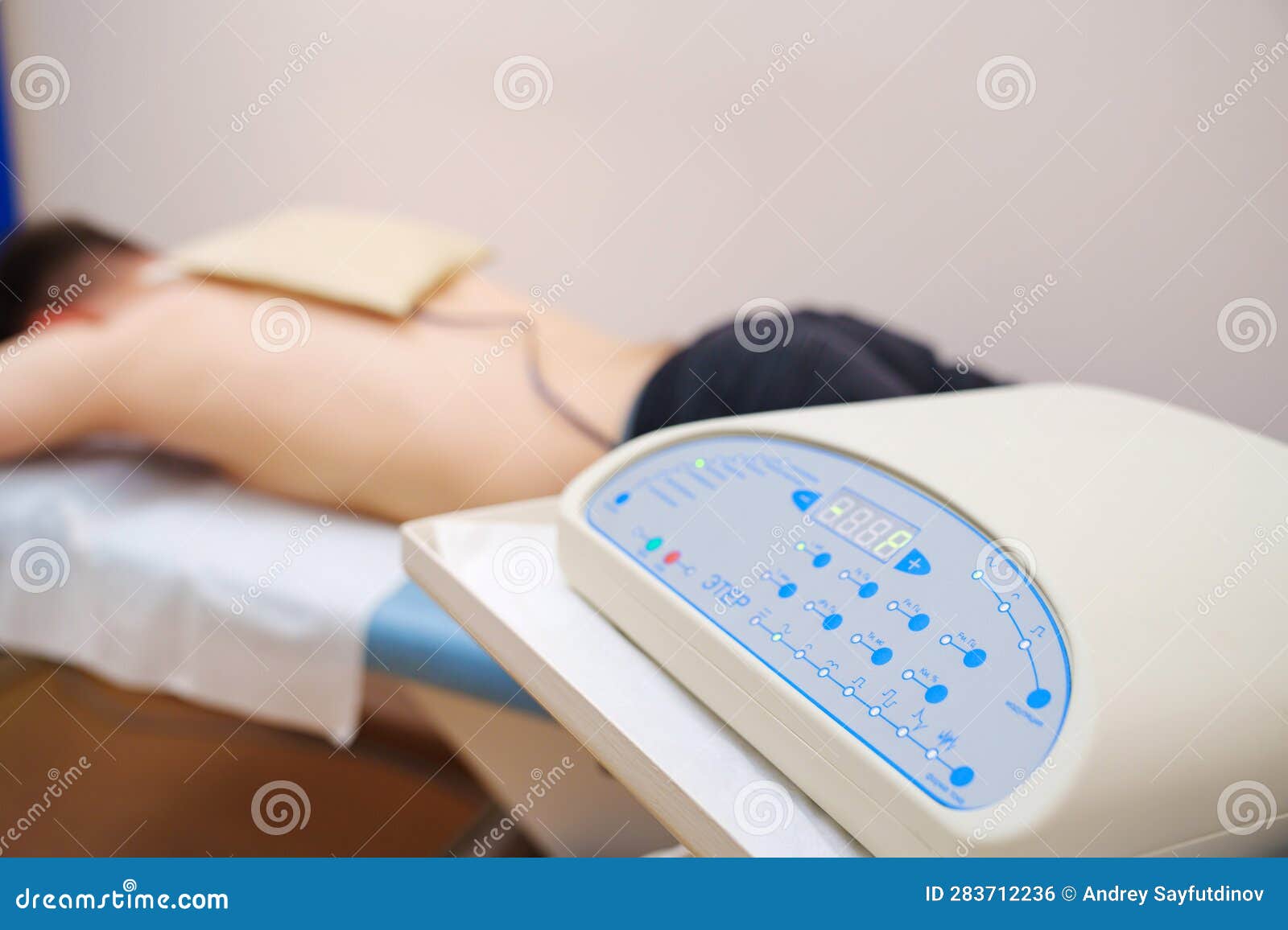 Patient with ETER is an Electrotherapy on the Back. Editorial Photo ...