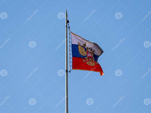 Russian Flag Fluttering in the Wind on a Flagpole Stock Photo - Image ...