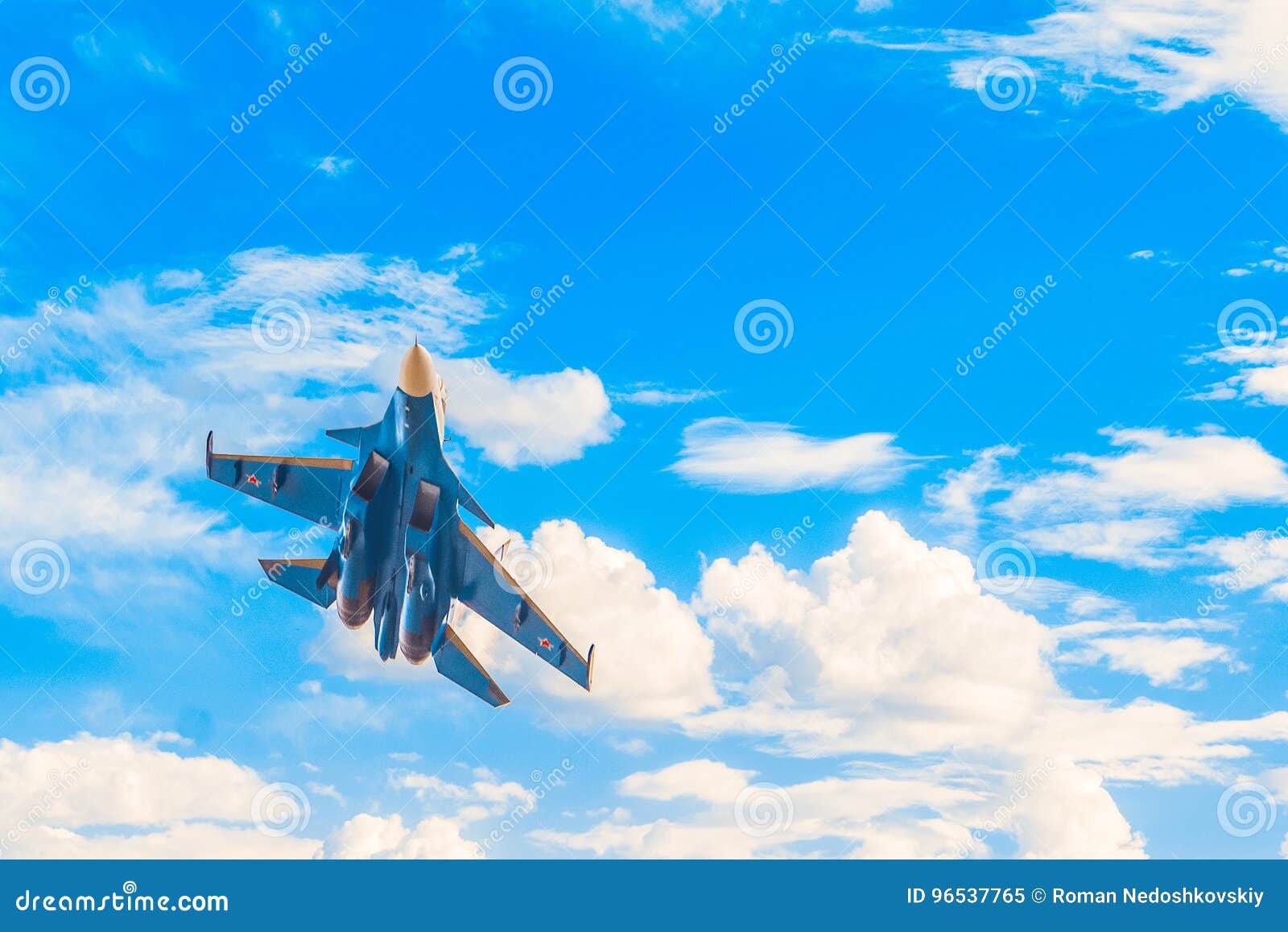 Russian Military Jet Fighter Flying in the Blue Cloudy Sky Stock Image ...