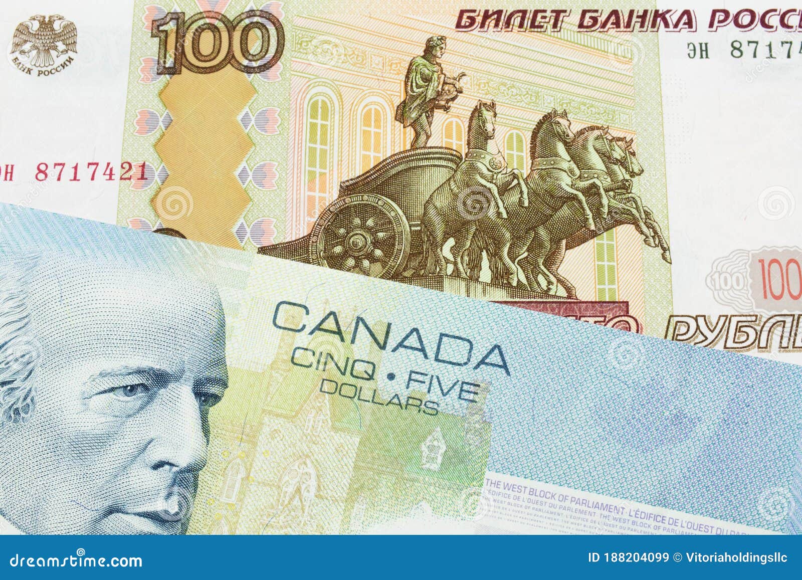 A Russian One Hundred Ruble Note Paired with a Blue Five Dollar Bill ...