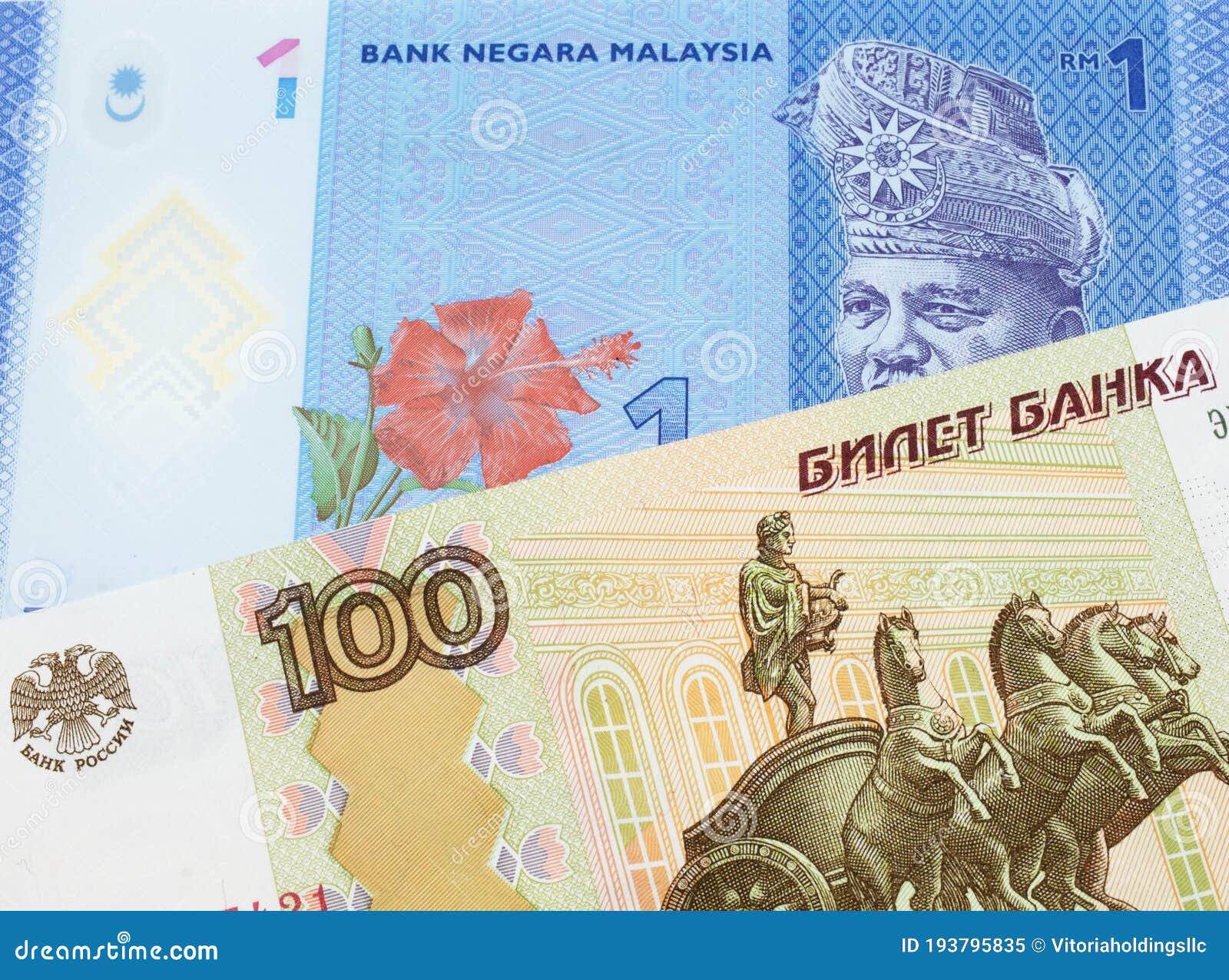 A Russian One Hundred Ruble Note Paired with a Blue, Plastic One ...