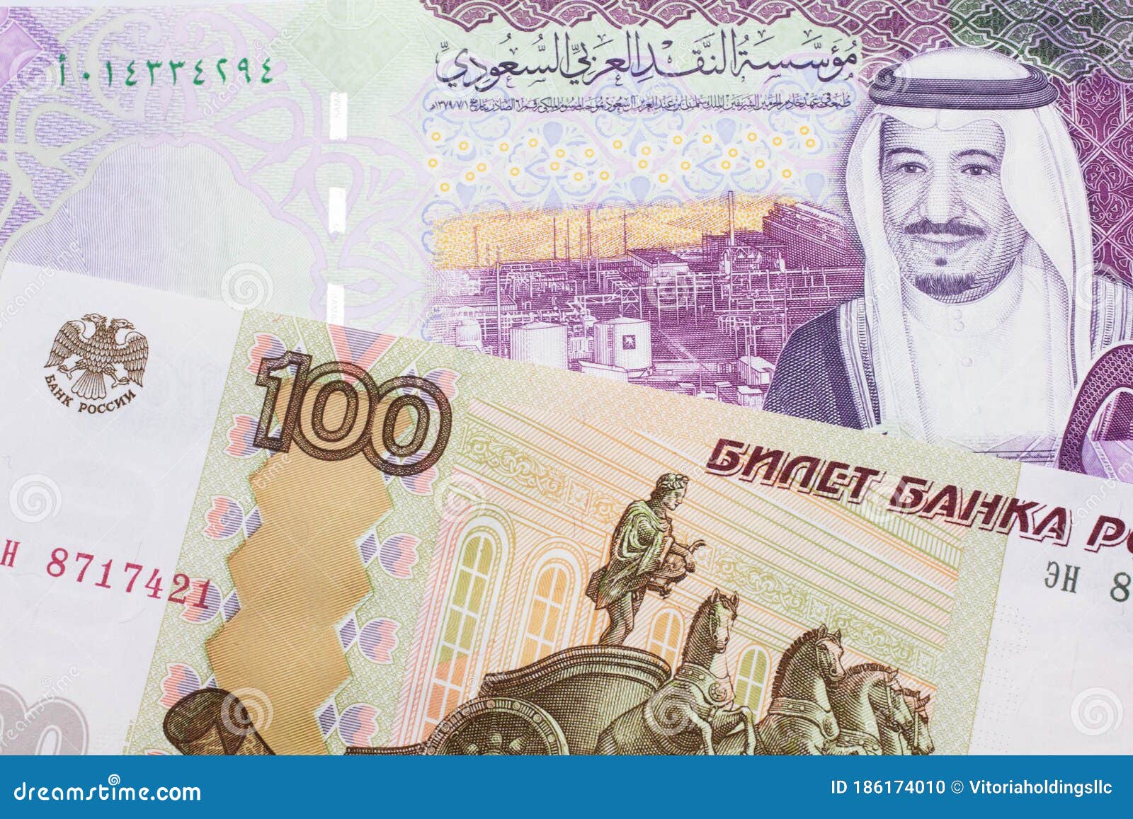 A 100 Russian Ruble Bank Note with a 5 Saudi Riyal Note in Macro Stock ...
